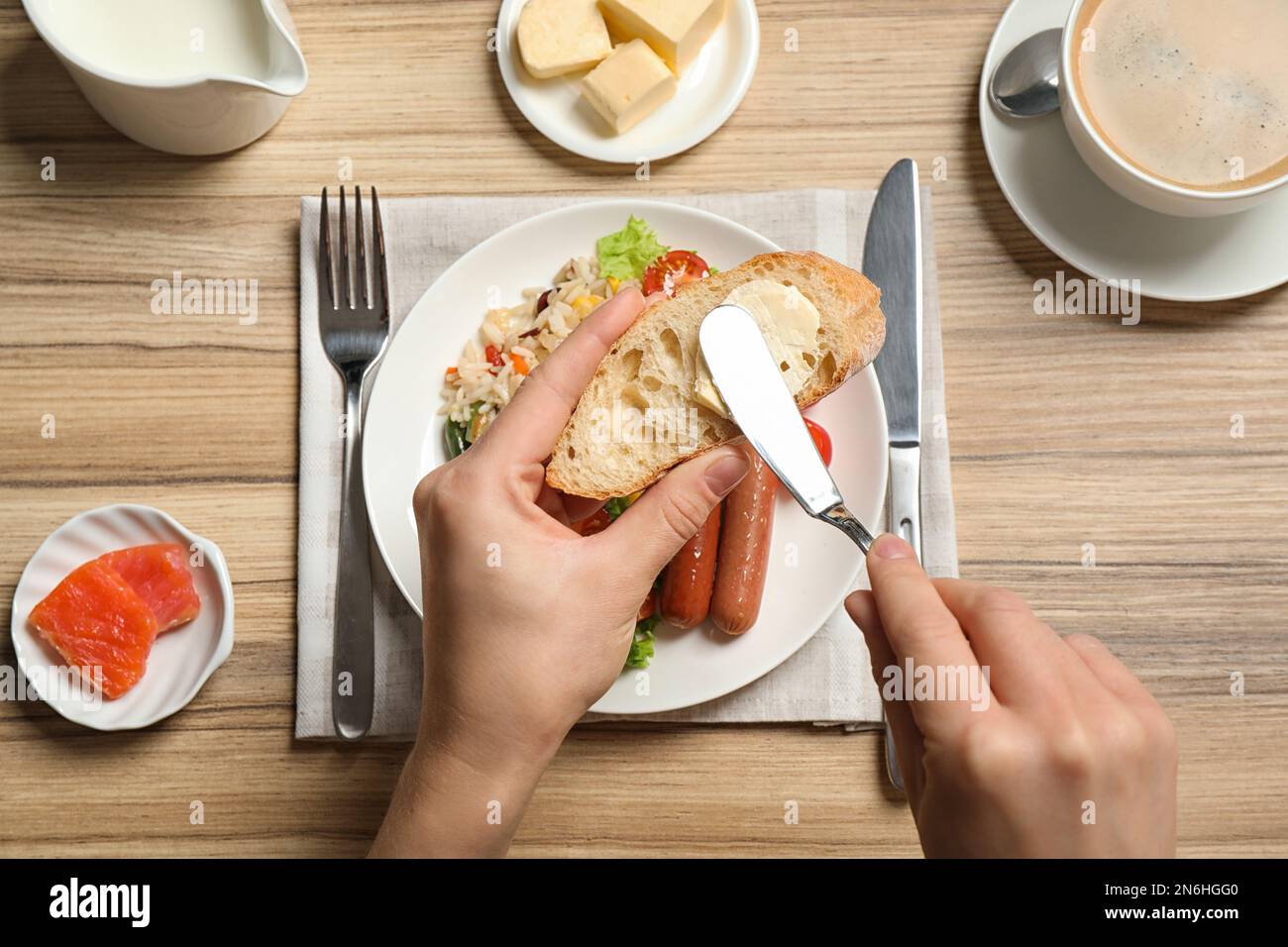 Person spreading butter on top hi-res stock photography and images - Alamy