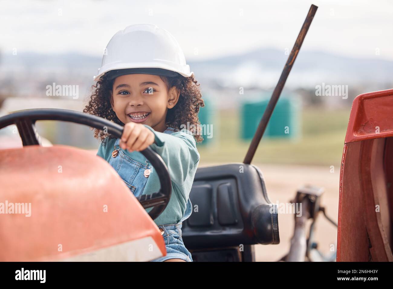 Girl child in tractor, portrait and farming transport, sustainability ...