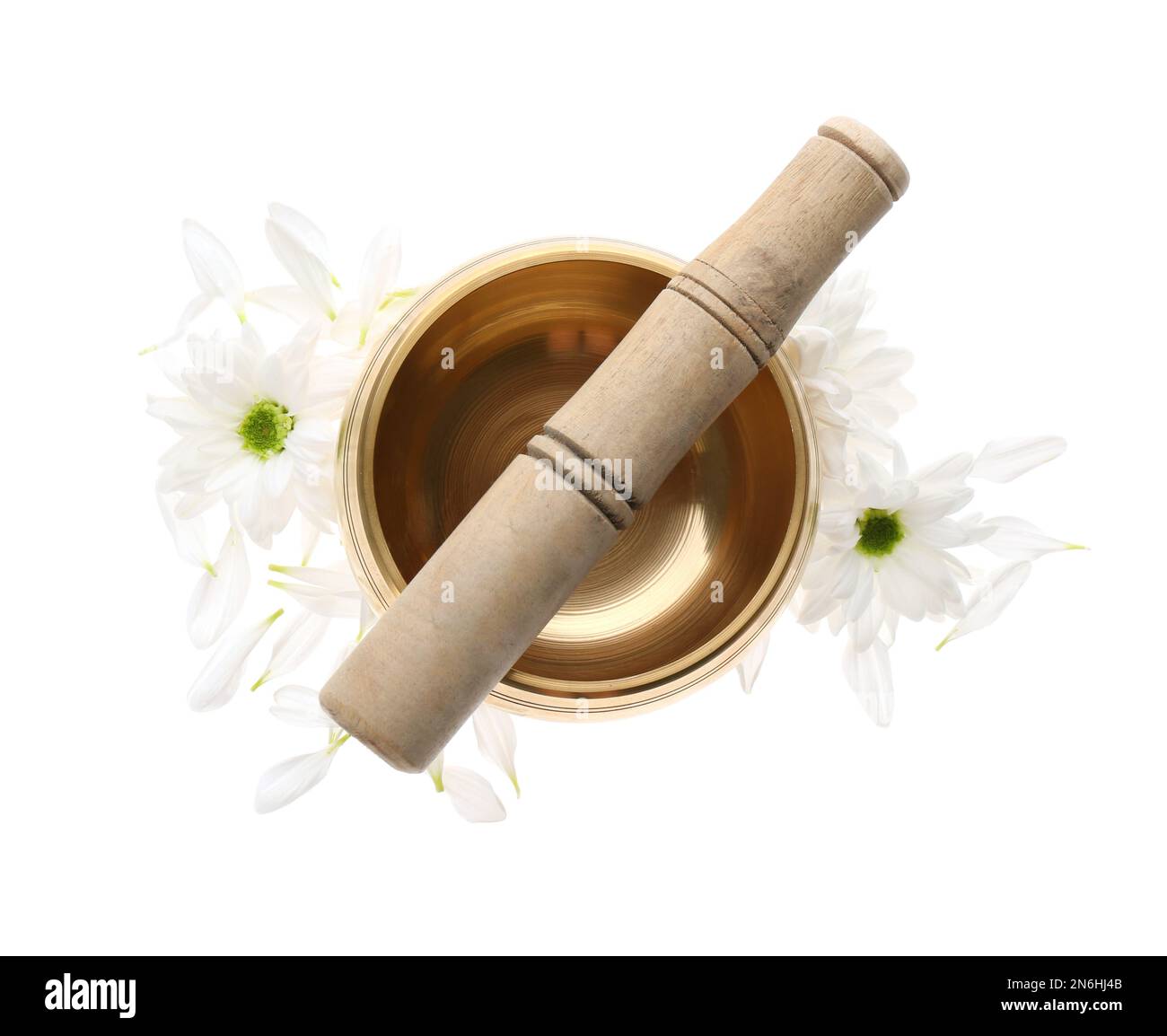Golden singing bowl with mallet and flowers on white background, top ...