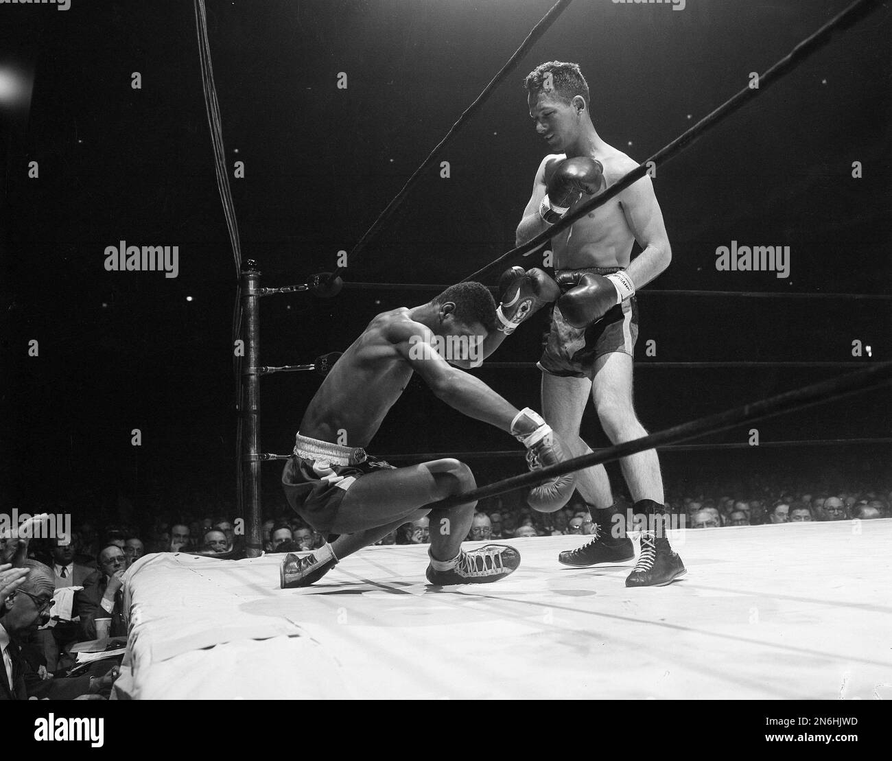 Don Morrison pounds Ernest Taylor into the ropes in second round of 118-pound Golden Gloves ...