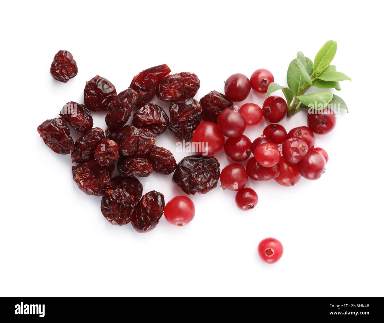 Tasty fresh and dried cranberries with leaves on white background, top ...