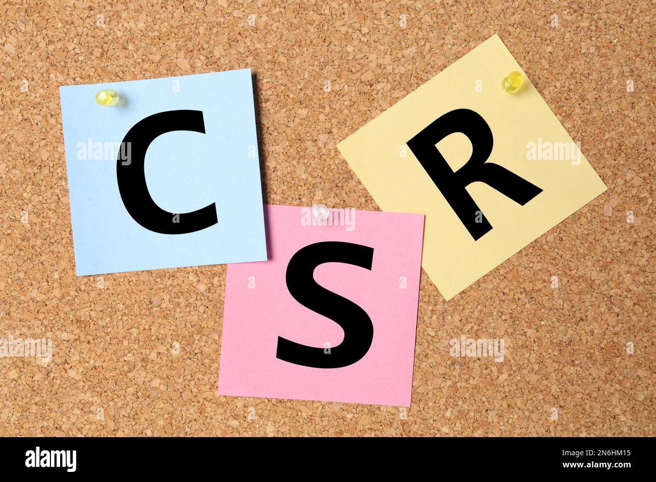 Abbreviation CSR made of paper notes on cork board. Corporate social ...