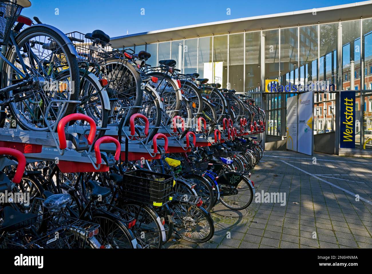 Very many bicycles at the parking spaces of the bike station at the ...