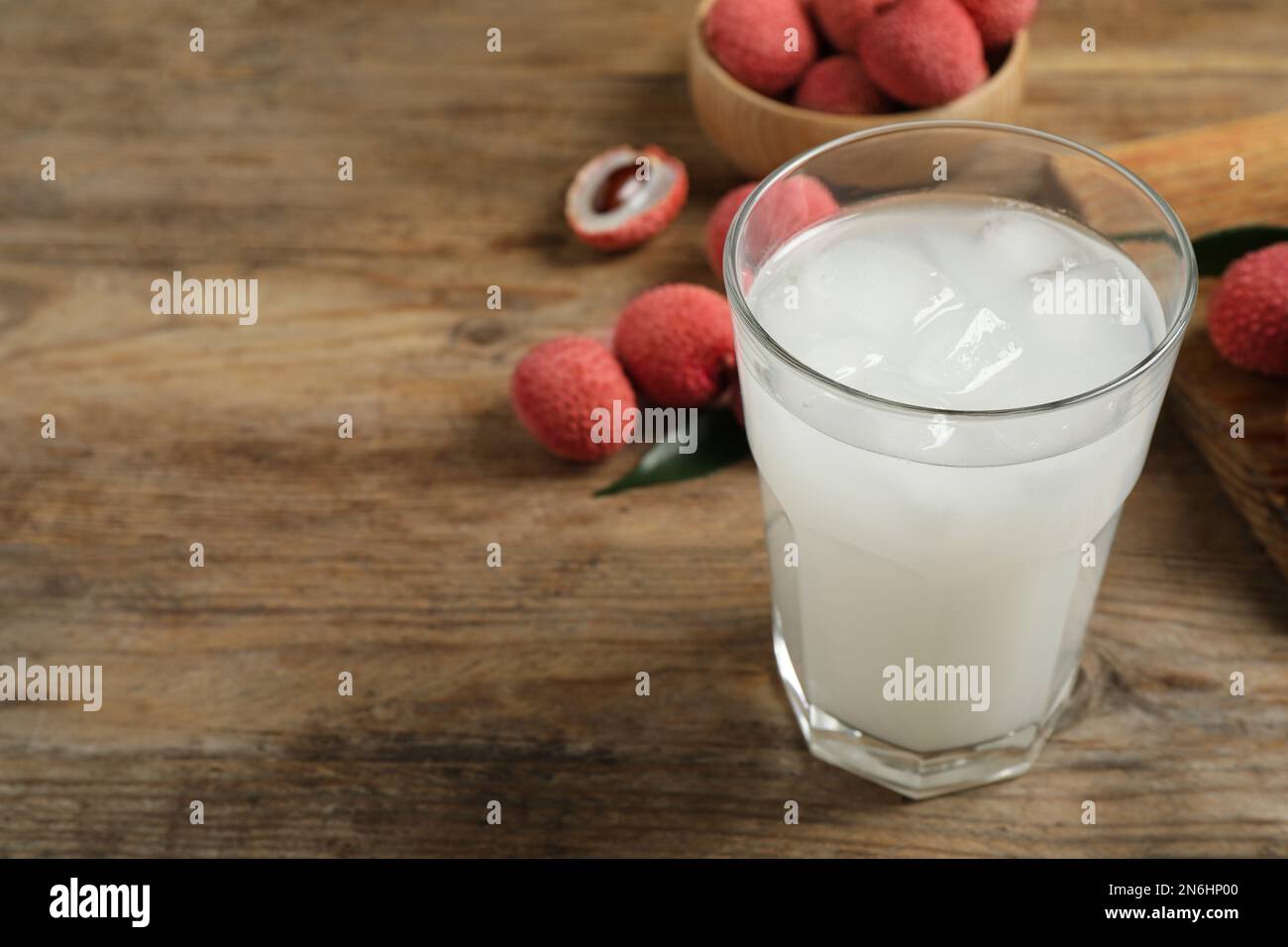 Fresh lychee juice on wooden table. Space for text Stock Photo - Alamy