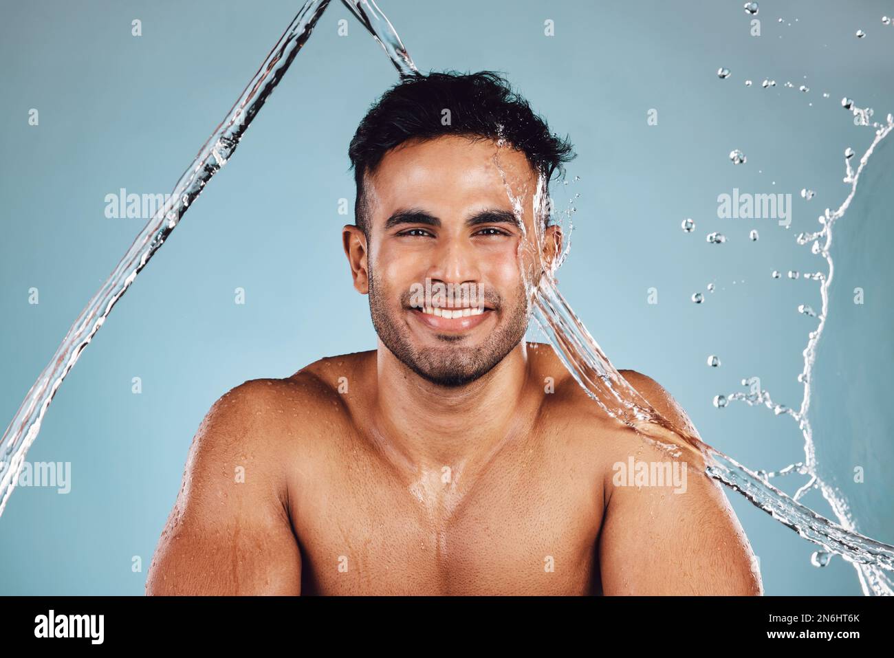 Water splash, portrait and skincare man isolated on blue background ...