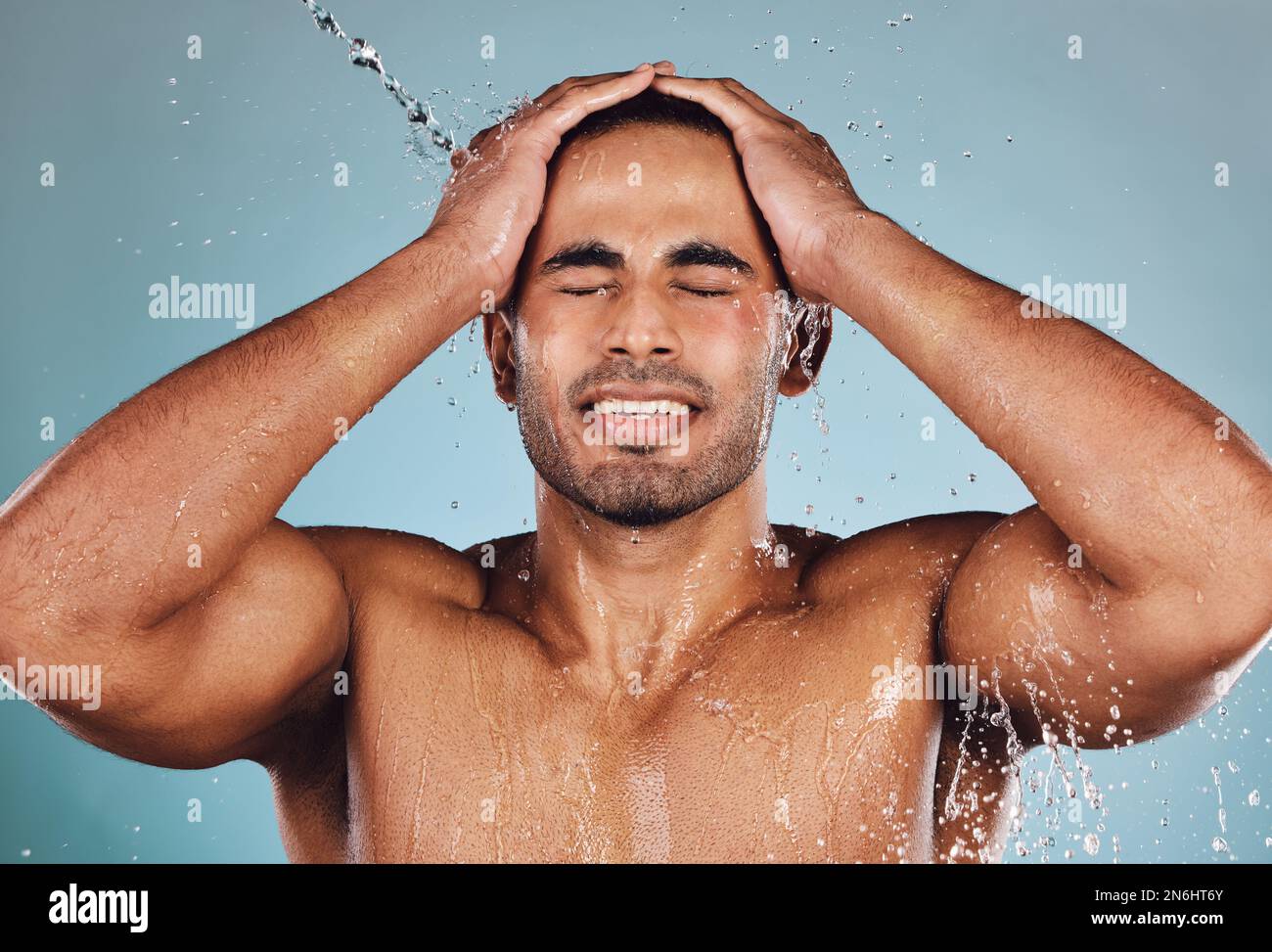 Man, water splash and face wash for skincare hygiene, hydration or ...