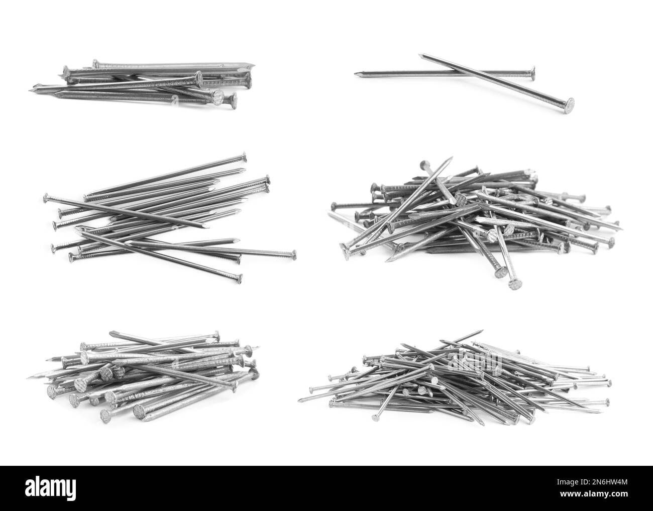 Set with sharp metal nails on white background Stock Photo - Alamy