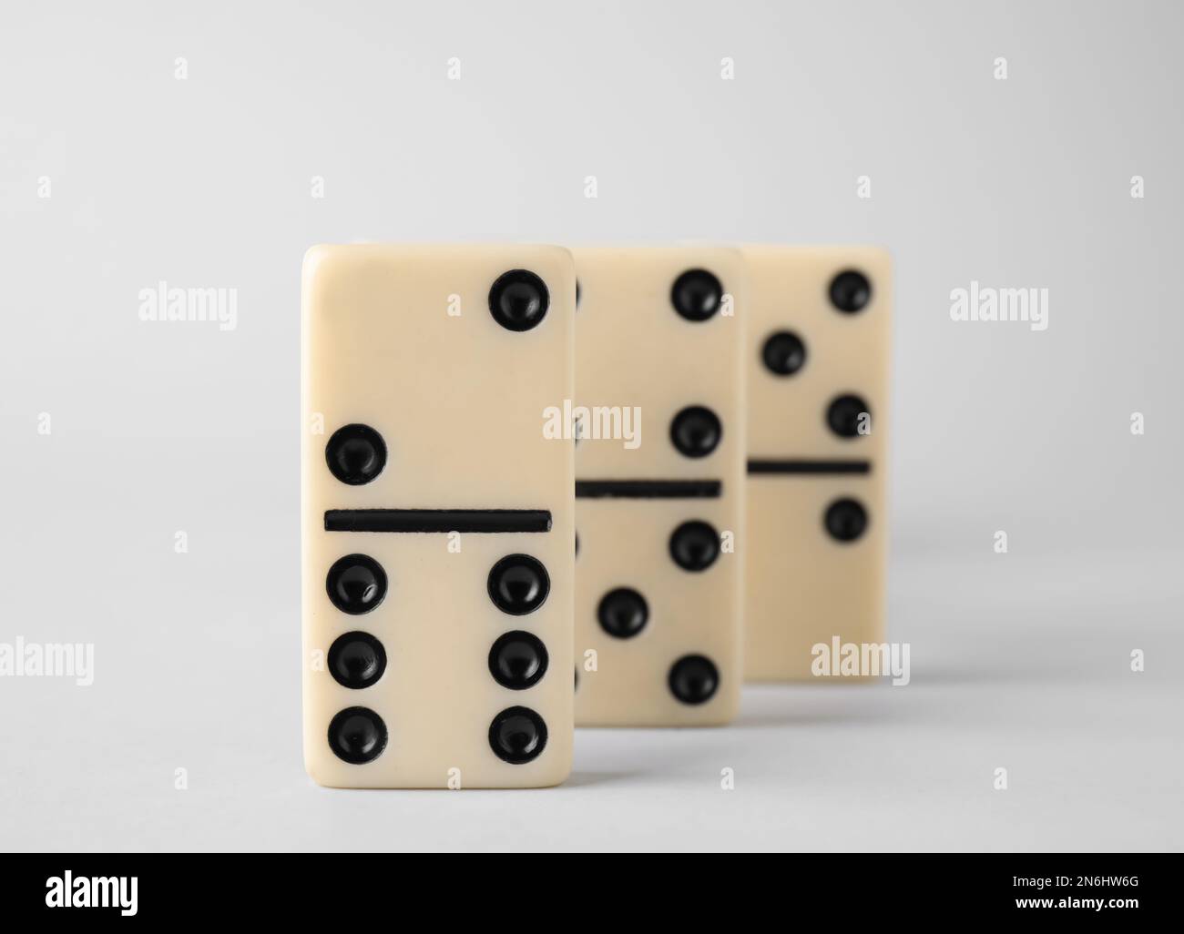 Row of domino tiles on white background, closeup Stock Photo - Alamy