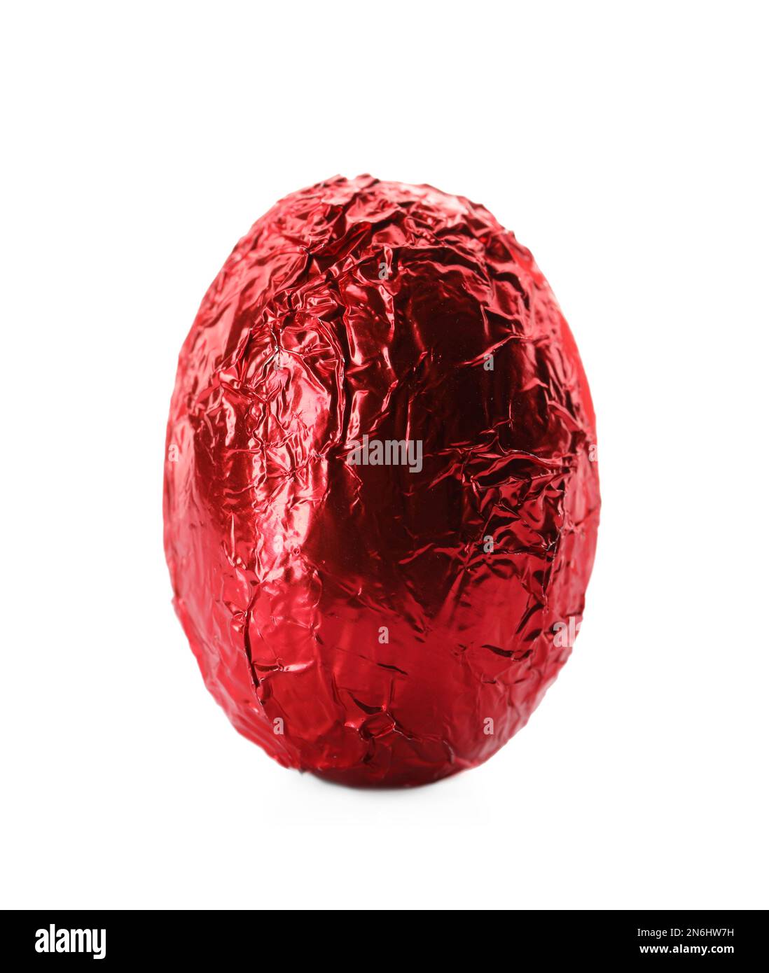 Chocolate egg wrapped in bright red foil isolated on white Stock Photo ...
