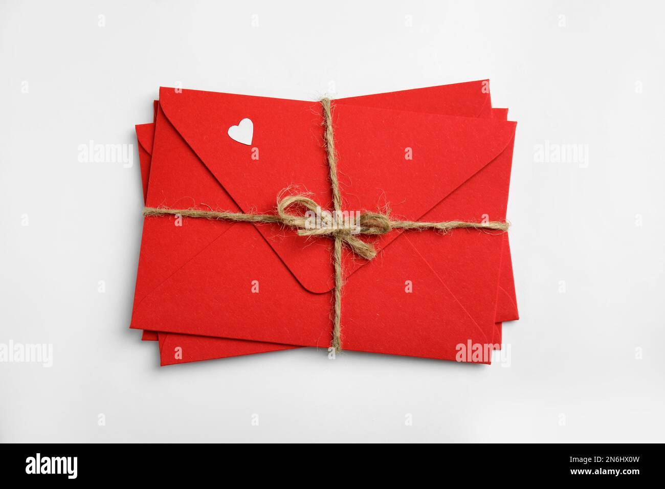 Stack of red envelopes on white background, top view. Love letters ...