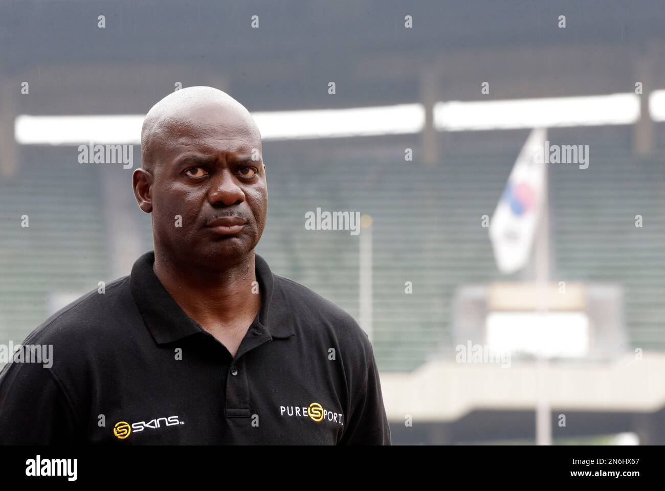 Canada's former sprinter Ben Johnson poses as he stands in the track ...