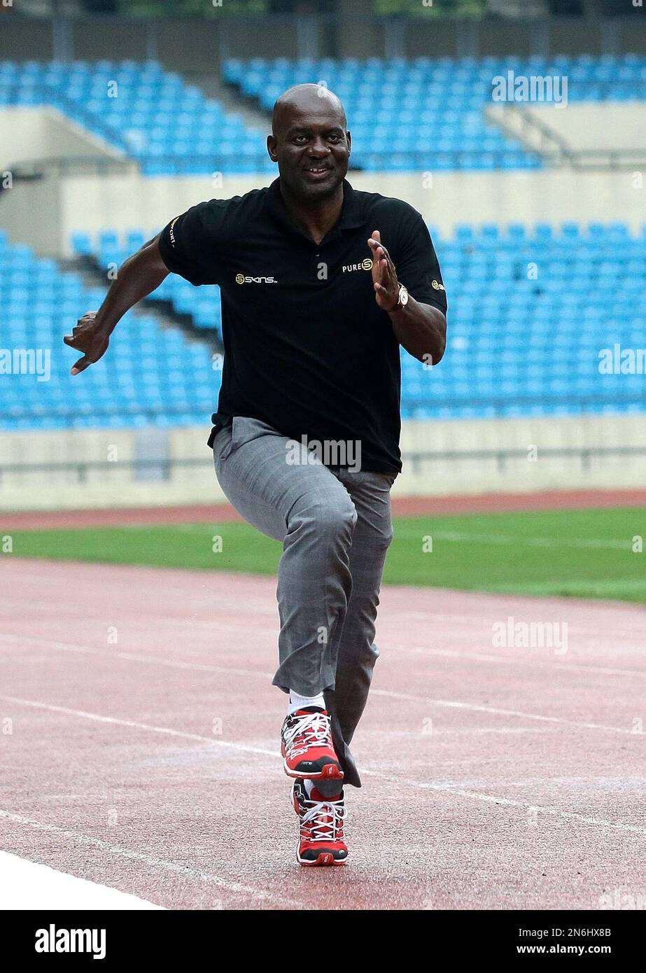 Canada's former sprinter Ben Johnson runs along a 100-meter-long ...