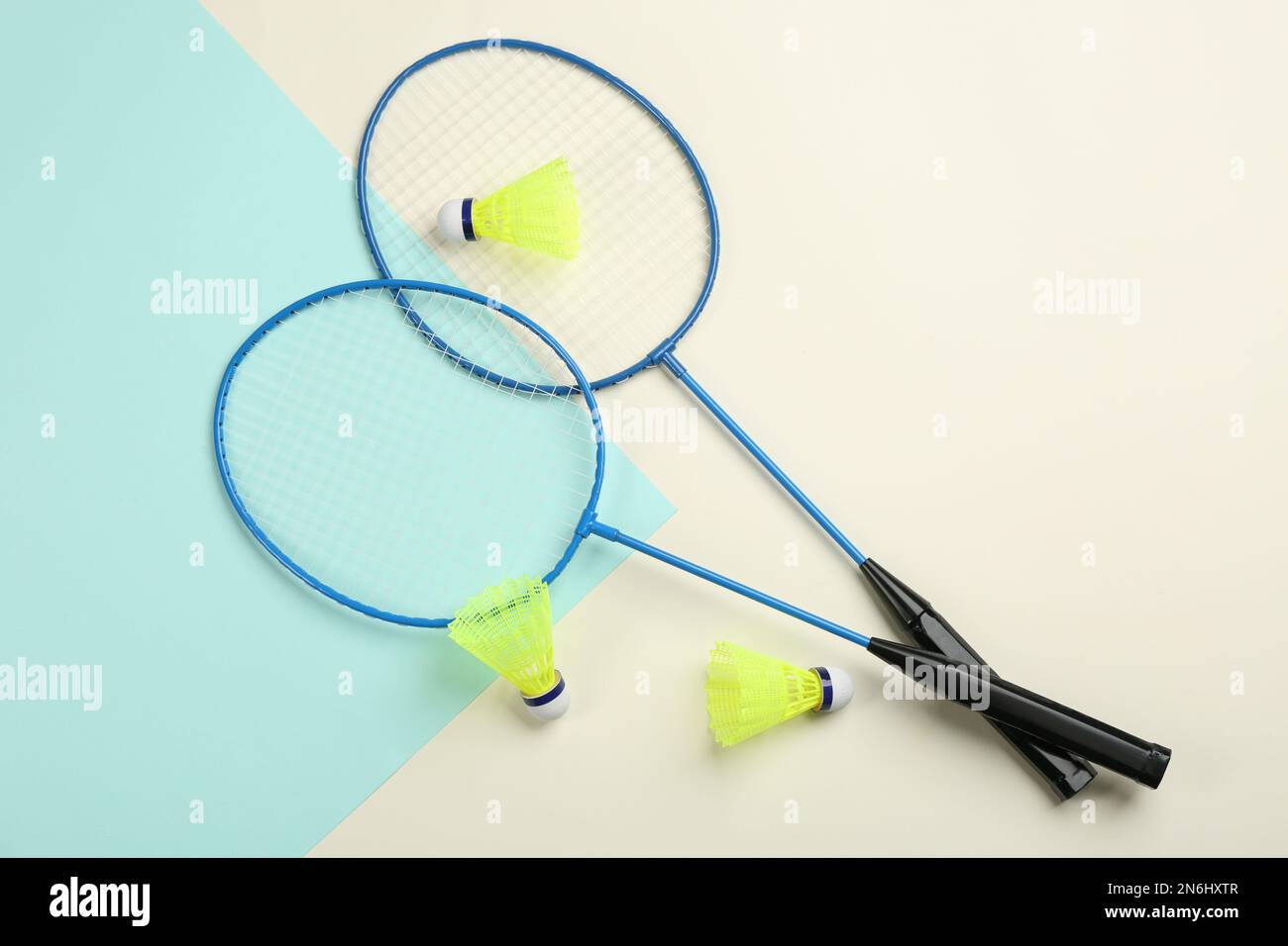 Rackets and shuttlecocks on color background, flat lay. Badminton ...