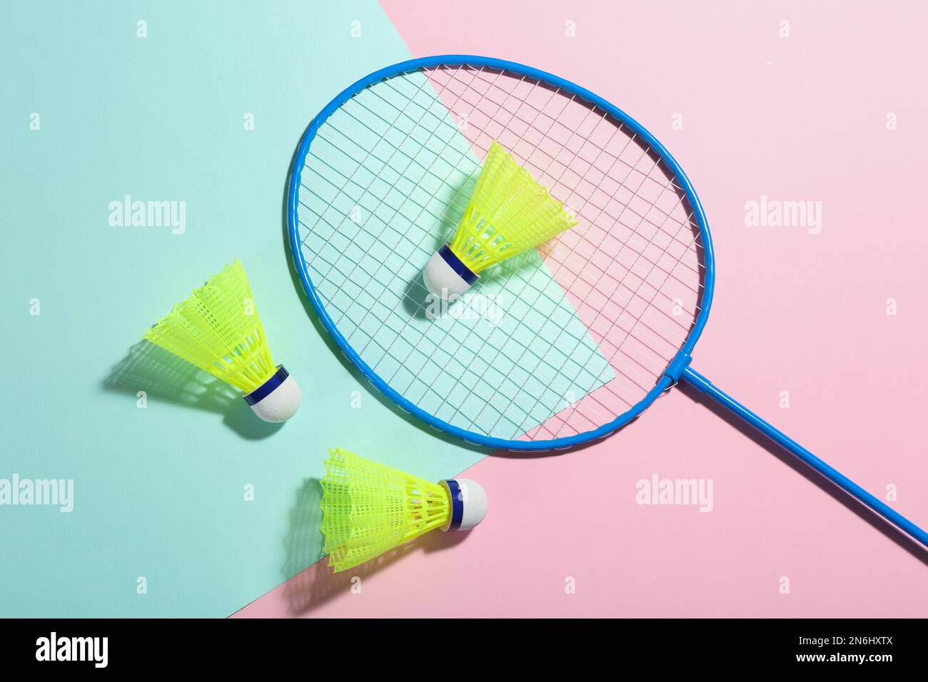 Badminton racket and shuttlecocks on color background, flat lay Stock ...