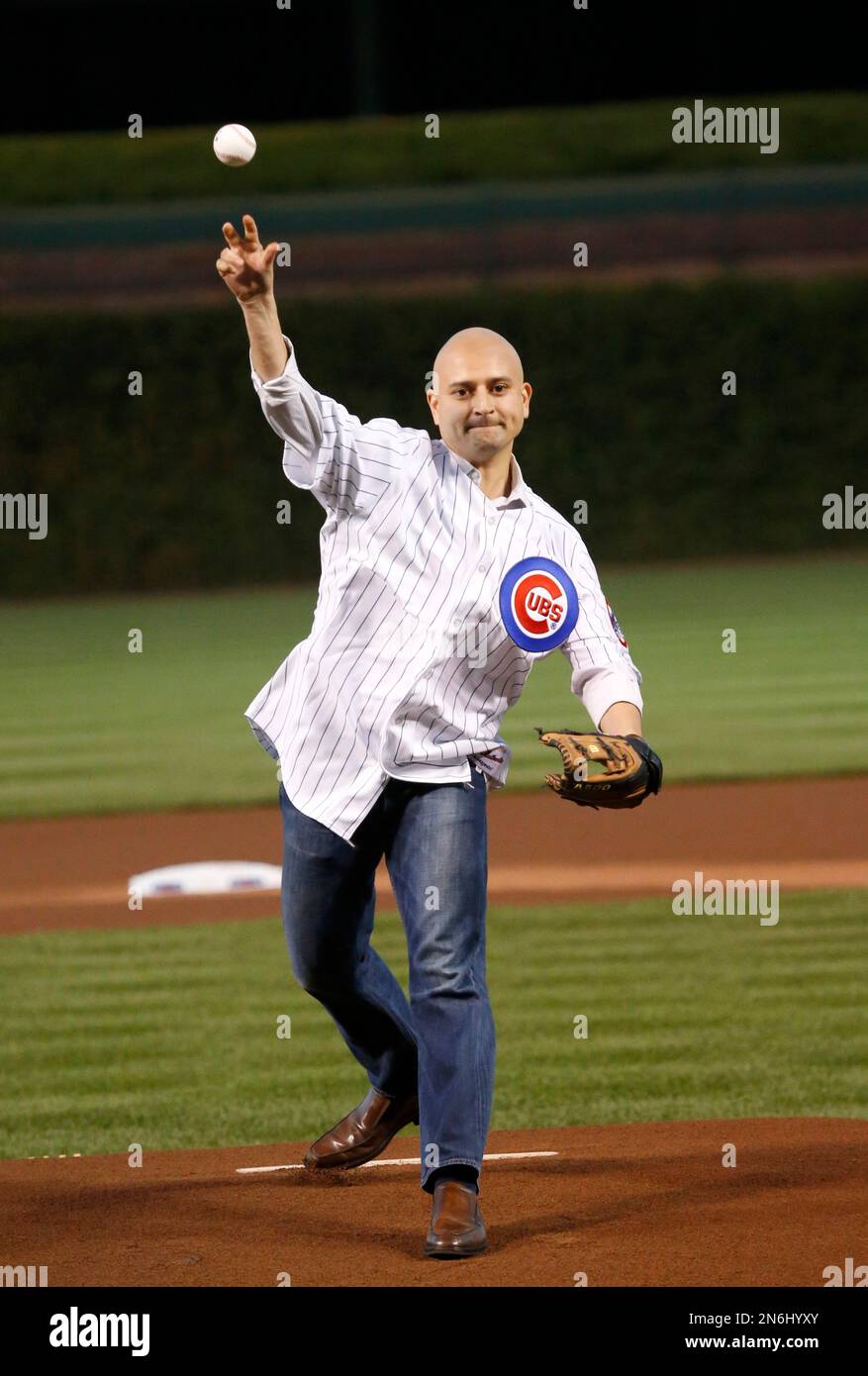 Omar Duque throws out a ceremonial first pitch before a baseball game ...