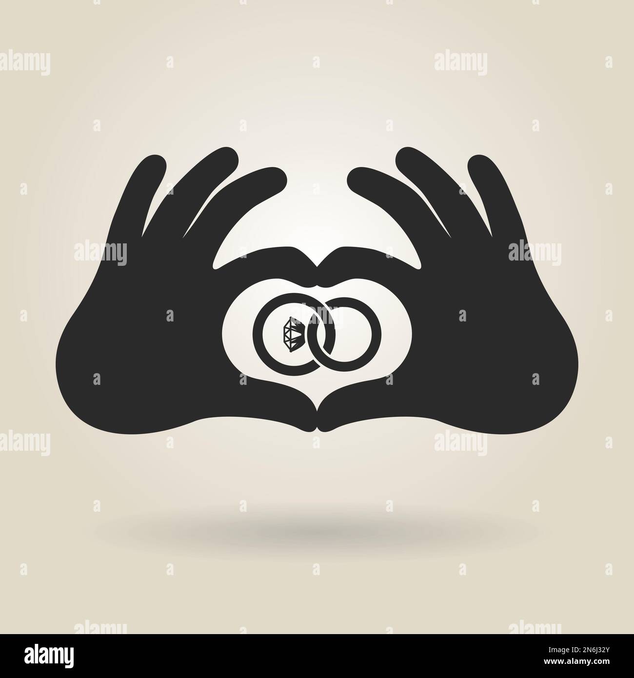 hand gesture a sign of heart with wedding rings on a light background ...