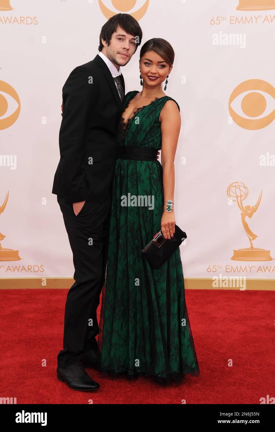 Matt Prokop, left, and Sarah Hyland arrive at the 65th Primetime Emmy ...