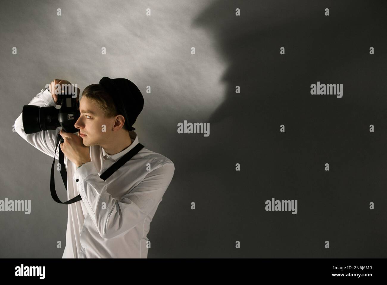 Man is photographing with camera Stock Photo - Alamy