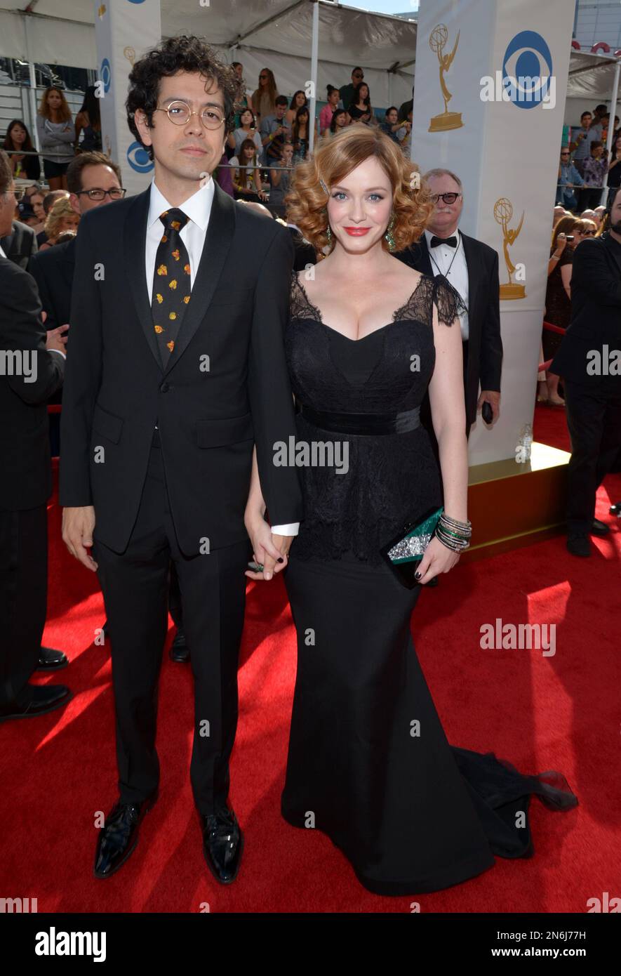 From left, Geoffrey Arend and Christina Hendricks arrive at the 65th ...