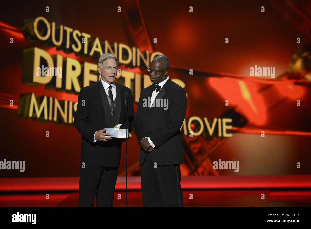 From left, presenters Mark Harmon and Andre Braugher speak onstage at ...