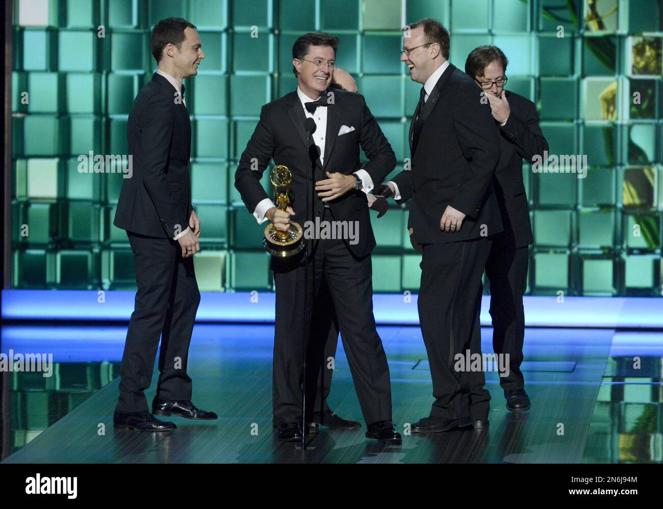 Jim Parsons, left, looks on as Stephen Colbert, center, and the cast ...