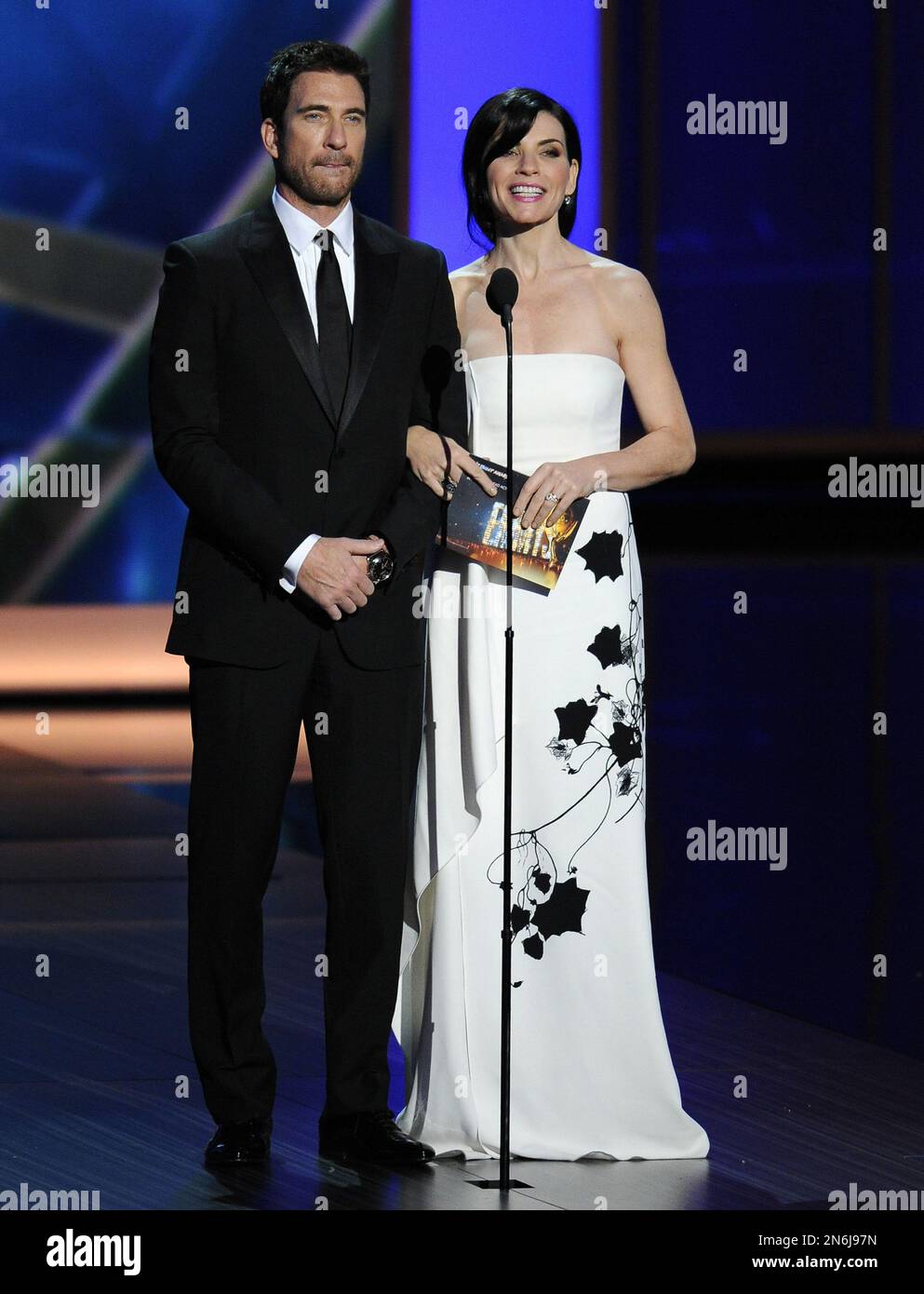 Dylan McDermott, left, and Julianna Margulies present the award for ...