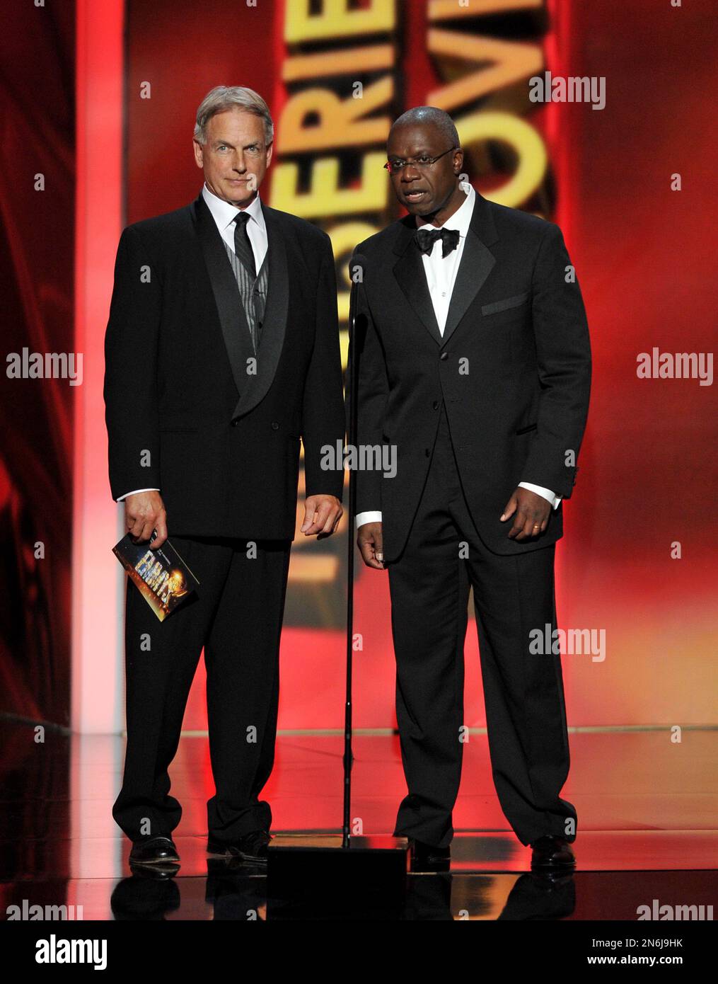 From left, Mark Harmon and Andre Braugher present the award for ...