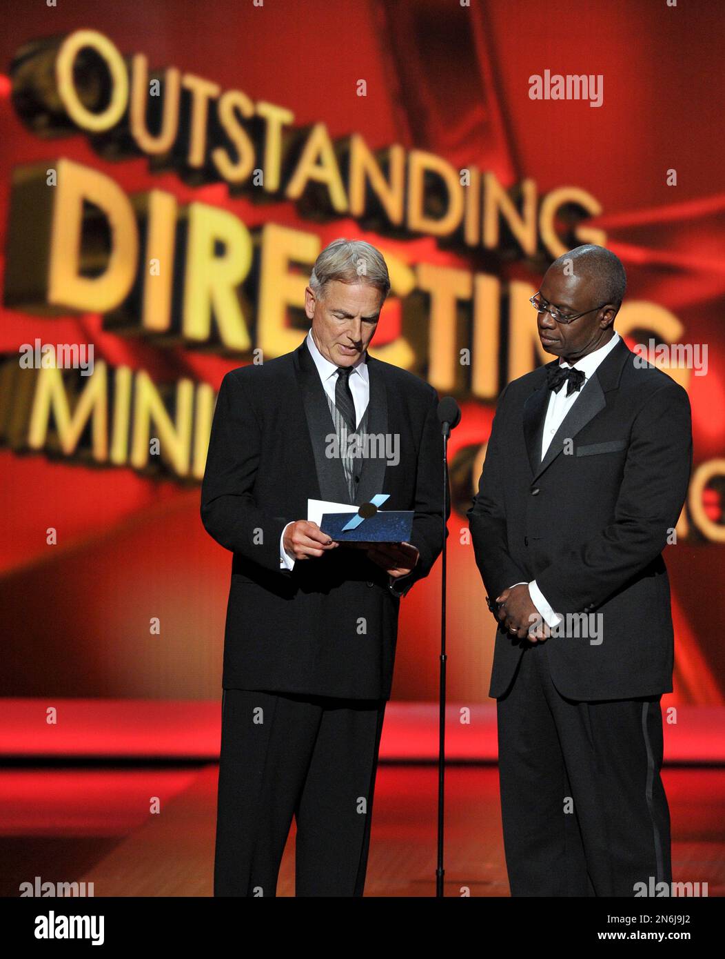 From left, Mark Harmon and Andre Braugher present the award for ...