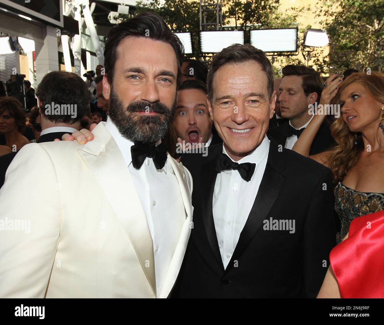 Jon Hamm, left, and Bryan Cranston arrive at the 65th Primetime Emmy ...