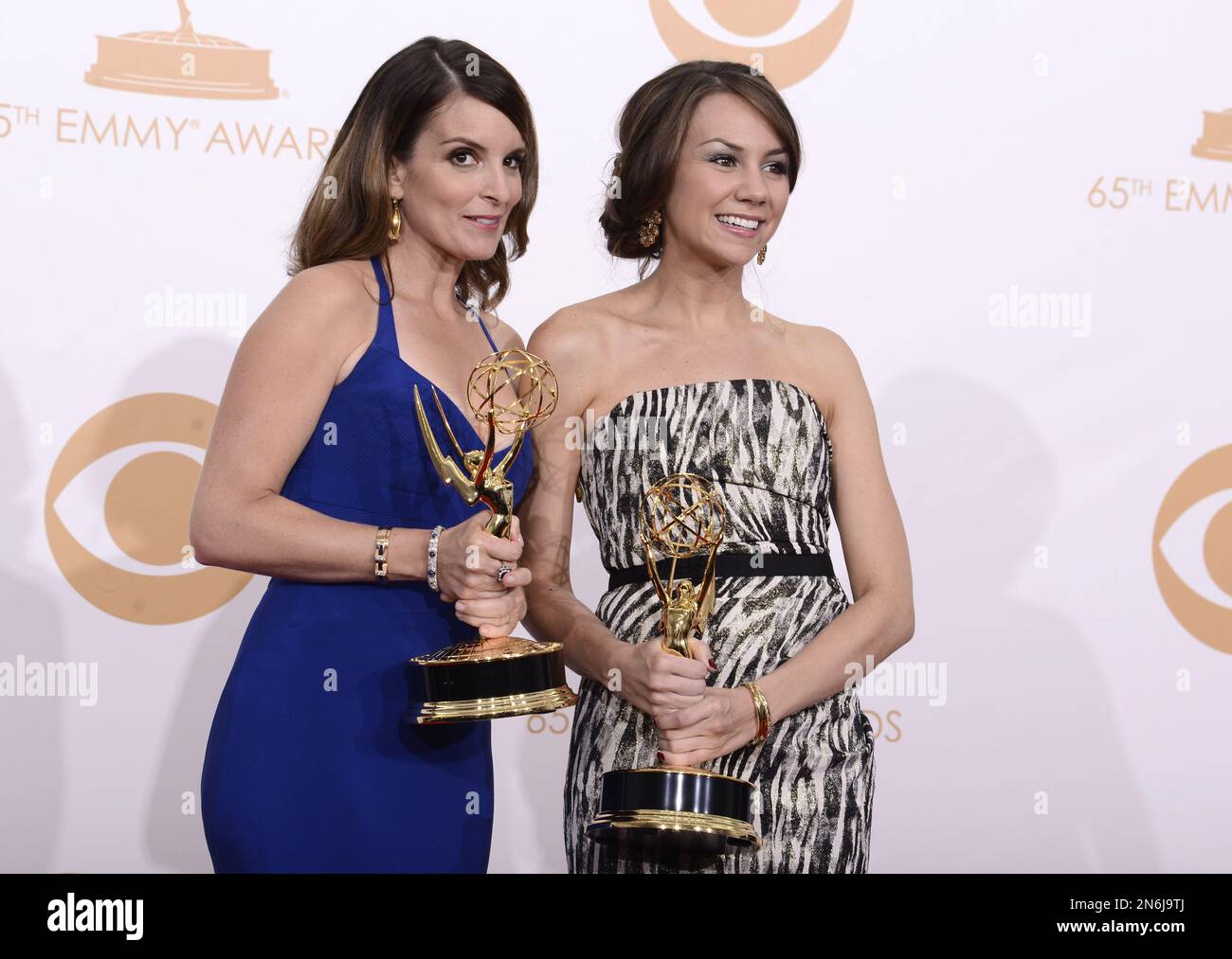 Tina Fey, left, and Tracey Wigfield pose backstage with the award for ...