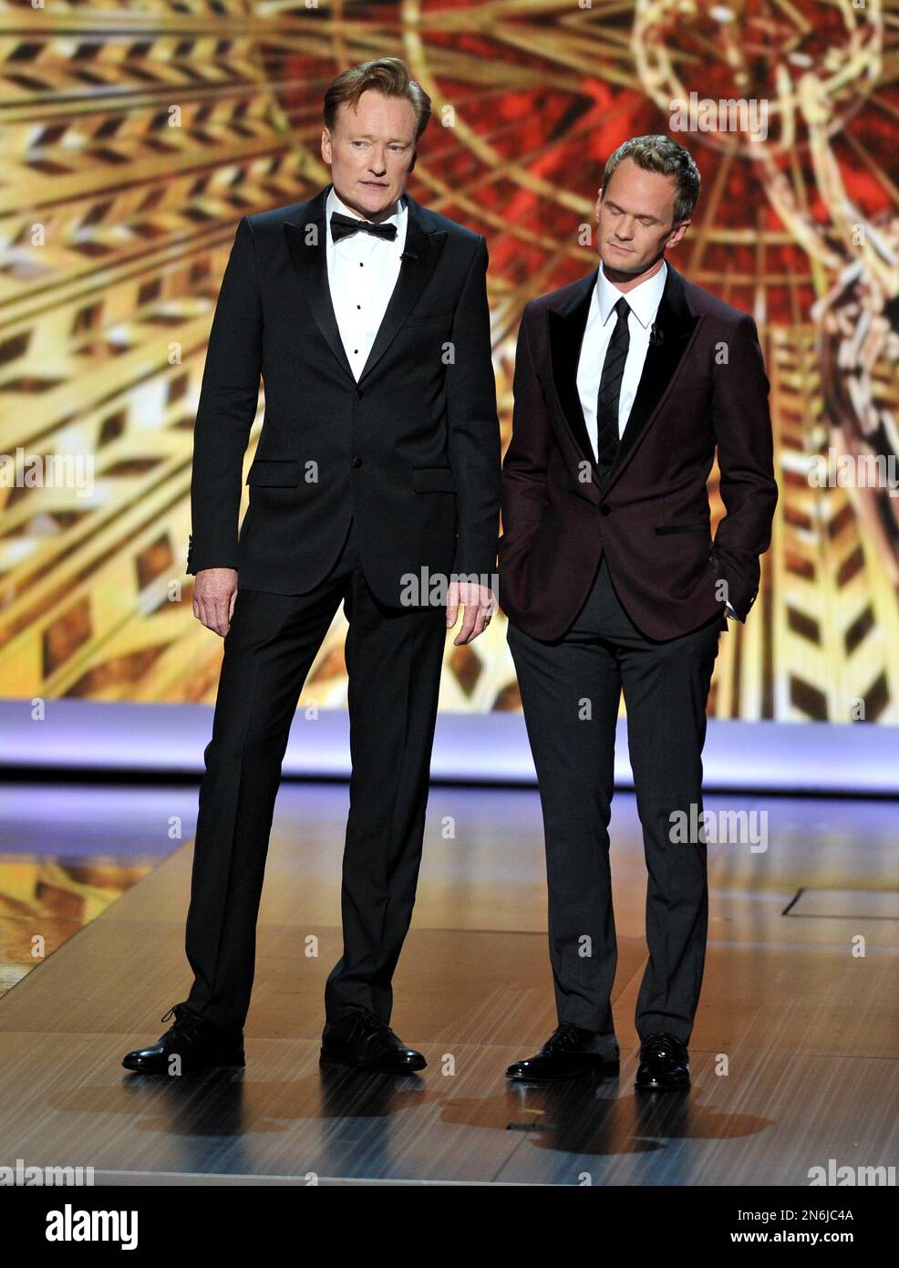 From left, Conan O'Brien and host Neil Patrick Harris speaks on stage ...