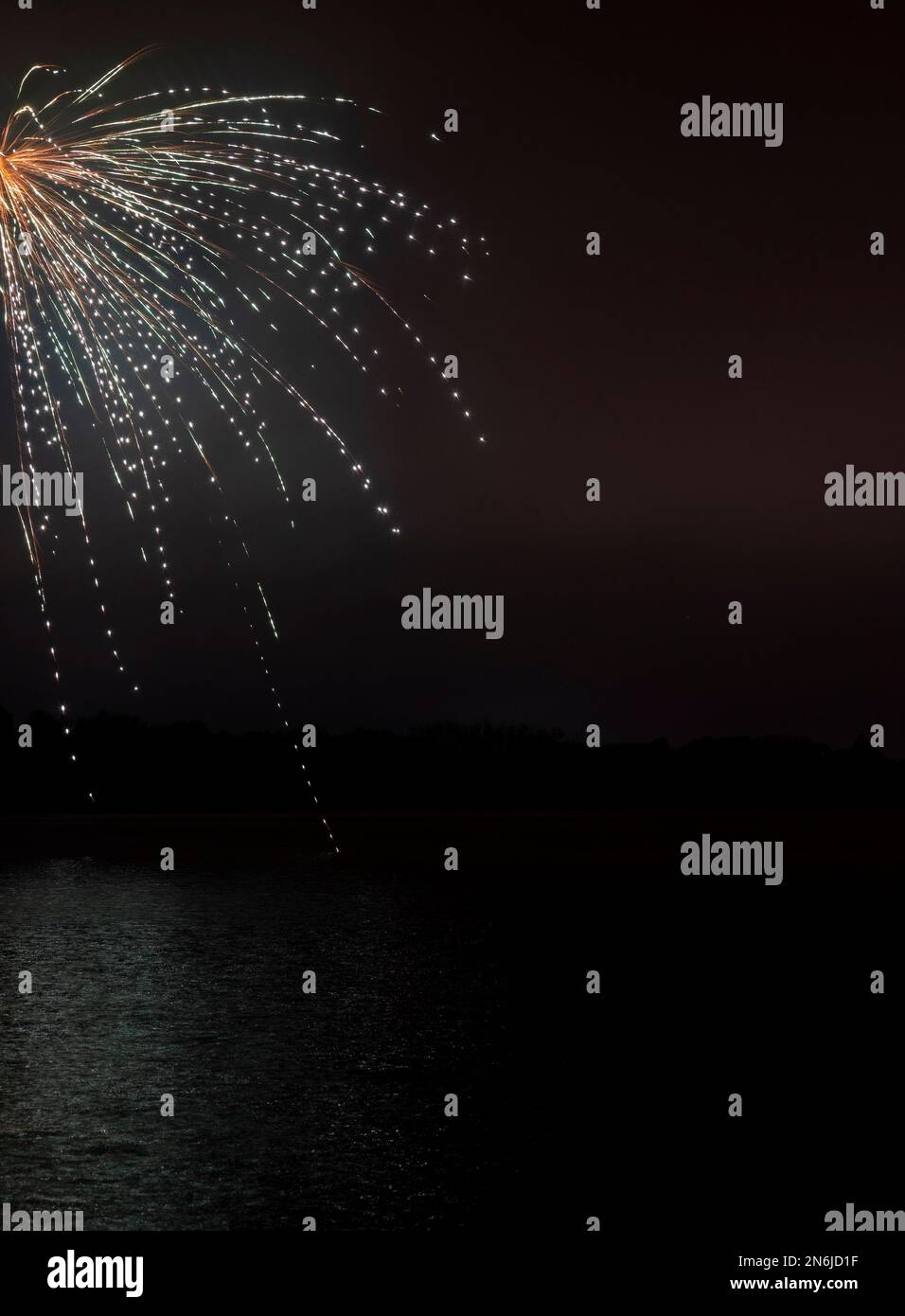 A beautiful firework over sea at night, dark sky background Stock Photo ...