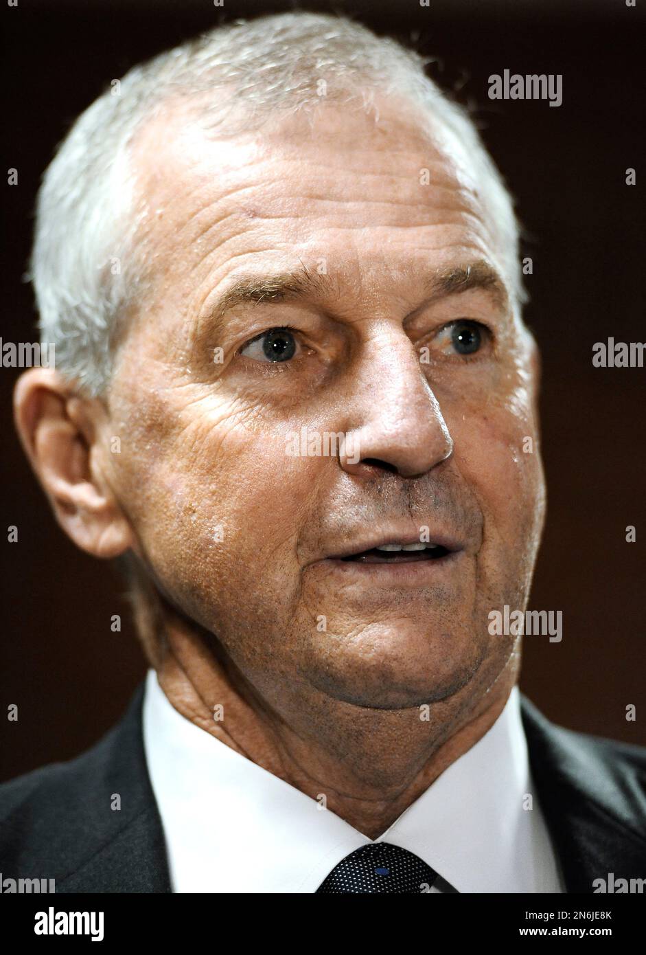 Former Connecticut basketball coach Jim Calhoun speaks with members of ...