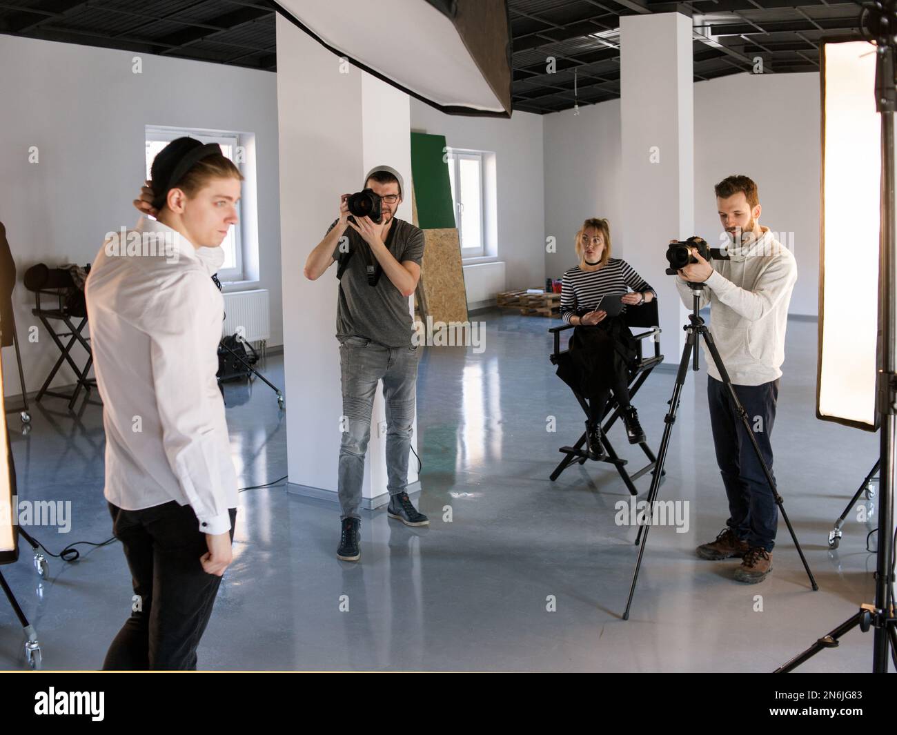 Creative team shooting in studio Stock Photo - Alamy