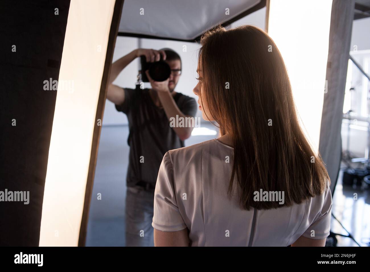 Photo session backstage. Photographer shoot model Stock Photo - Alamy