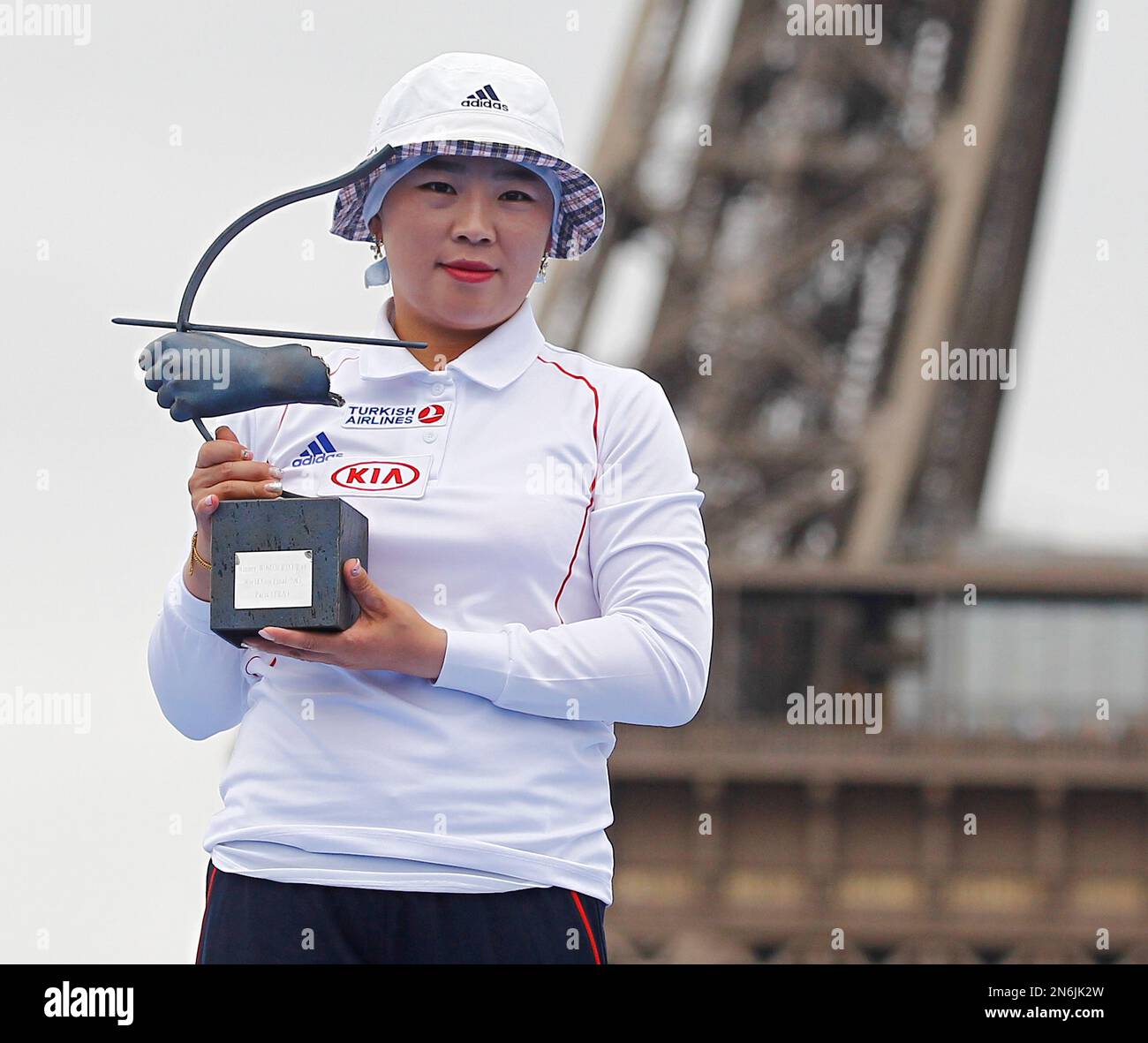 South Korean archer Yun Ok-Hee poses with her trophy after winning the ...