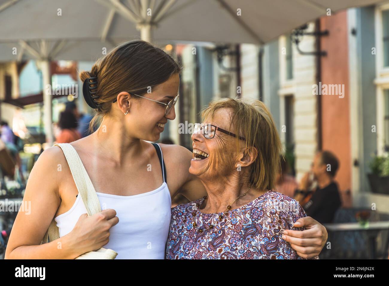 Teenager with her grandmother on a tour of the city. Two generations ...