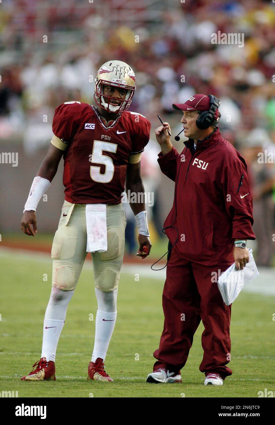 Florida State quarterback Jameis Winston (5) gets instructions from ...