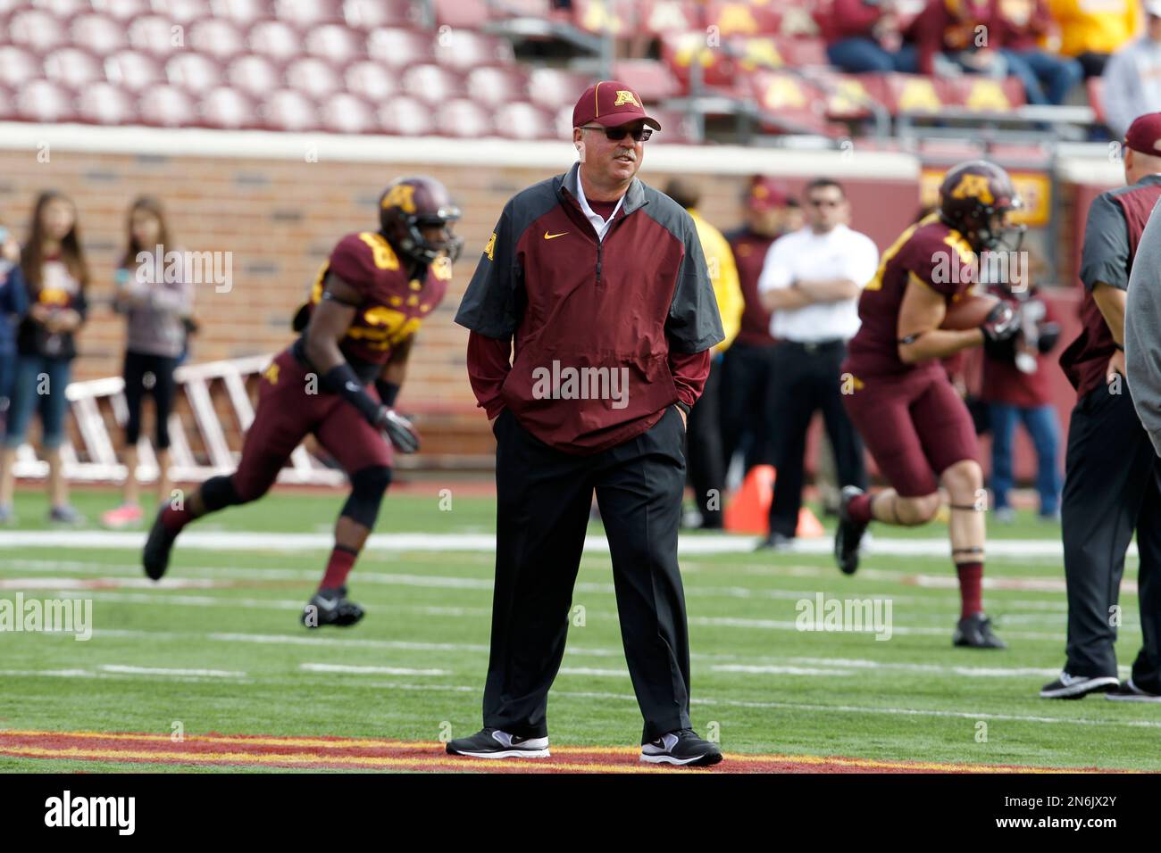Minnesota head coach Jerry Kill watches his team prior to an NCAA ...