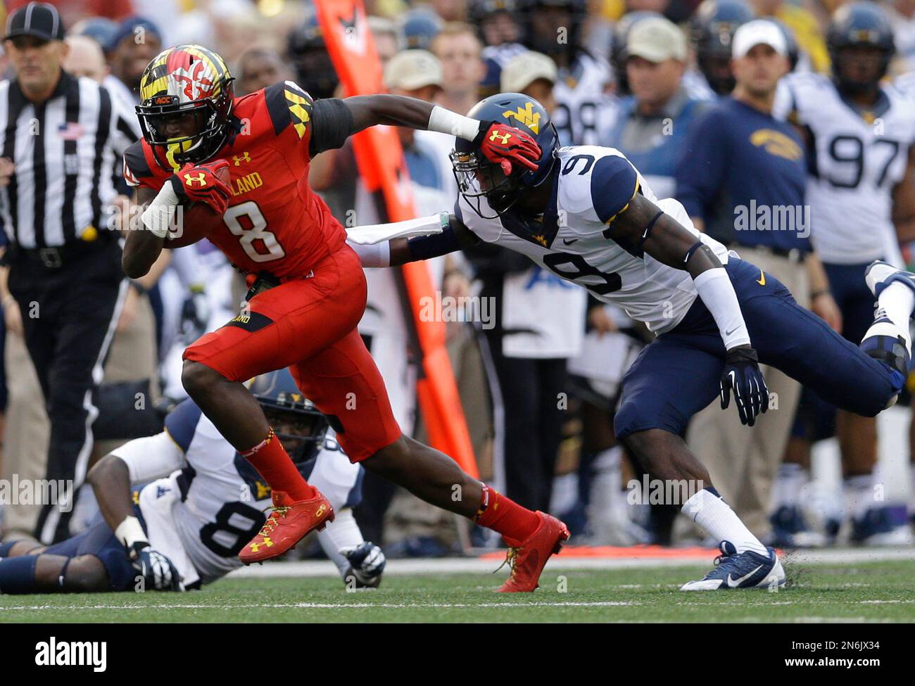 Maryland wide receiver Levern Jacobs (8) rushes past West Virginia ...