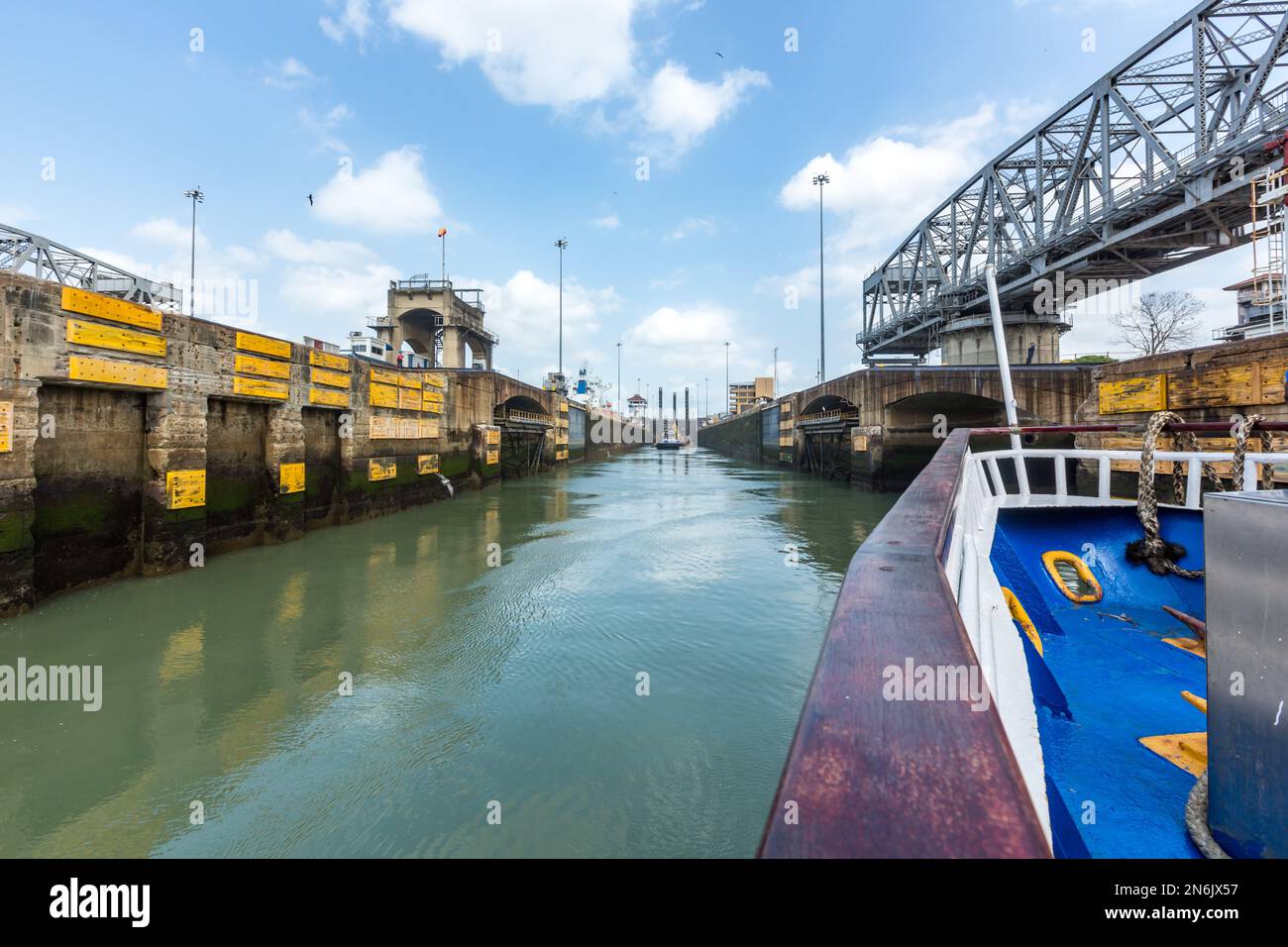 A tour boat enters the lock chamber at the MIraflores Locks on the ...