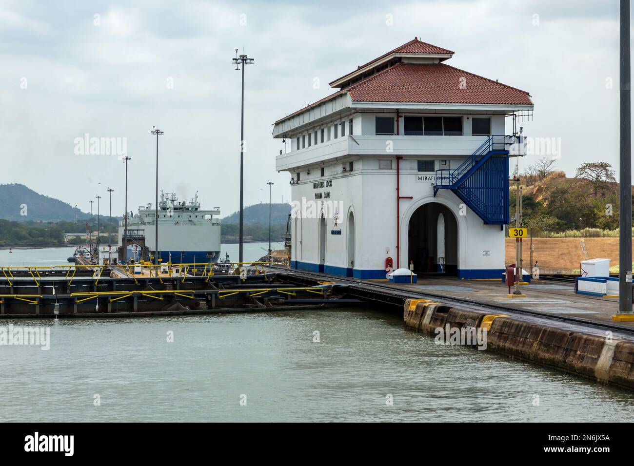 A large car carrier ship exits the lock chamber of the Miraflores Locks ...