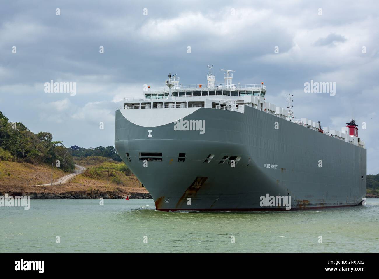 The Genius Highway, a large car carrier, moves through the Culebra Cut ...