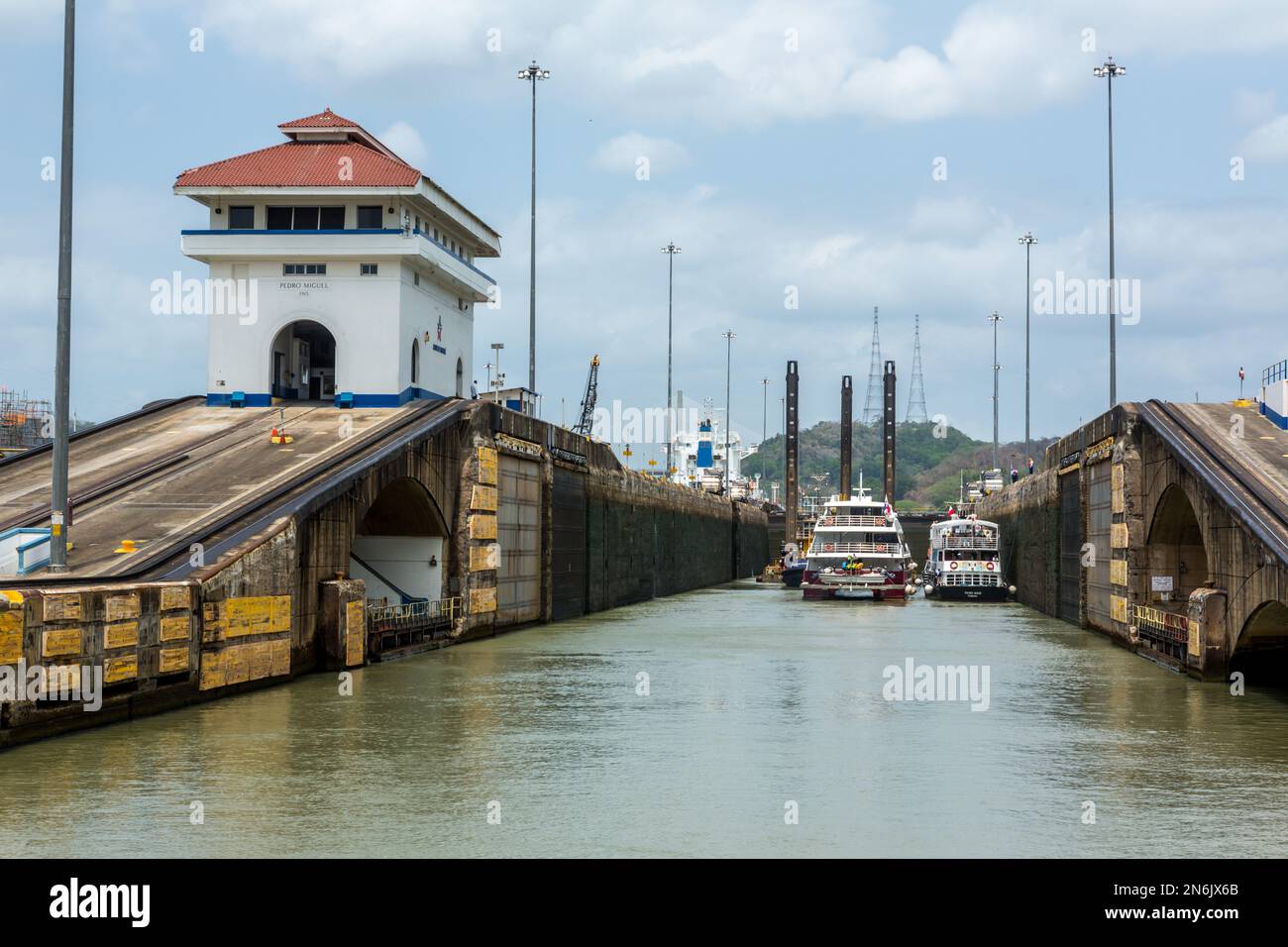 Tour boats and a dredger share the space in the lock chamber at the ...