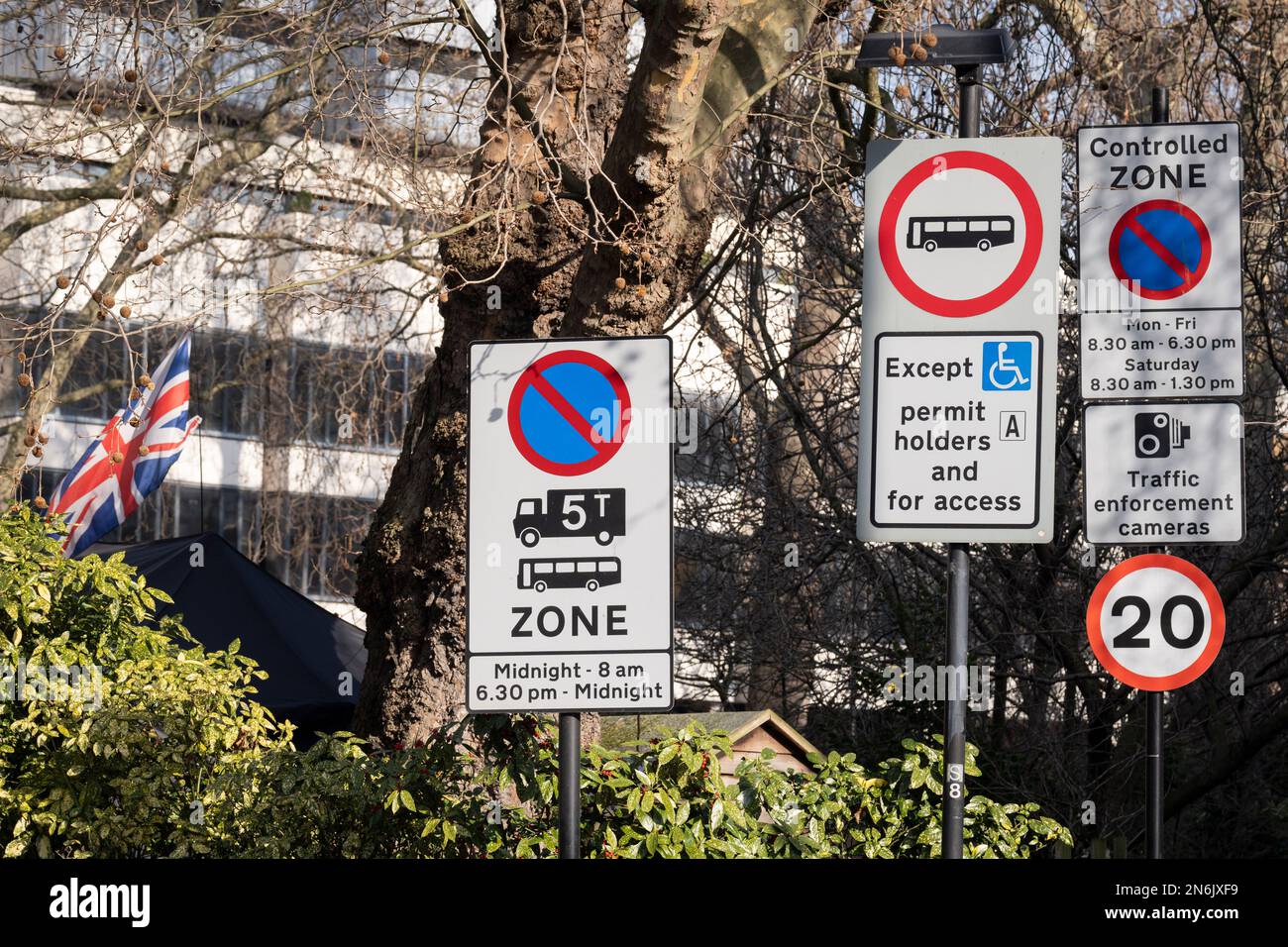 Multiple traffic road signs warning of weight limit, speed limit ...