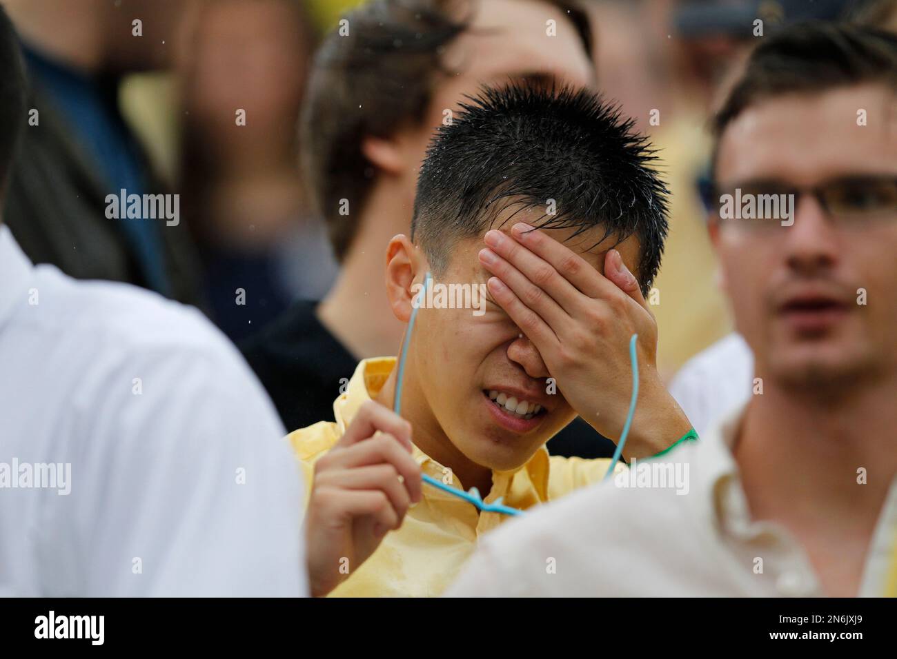 Georgia Tech fans cheer in the rain during the first half of an NCAA ...