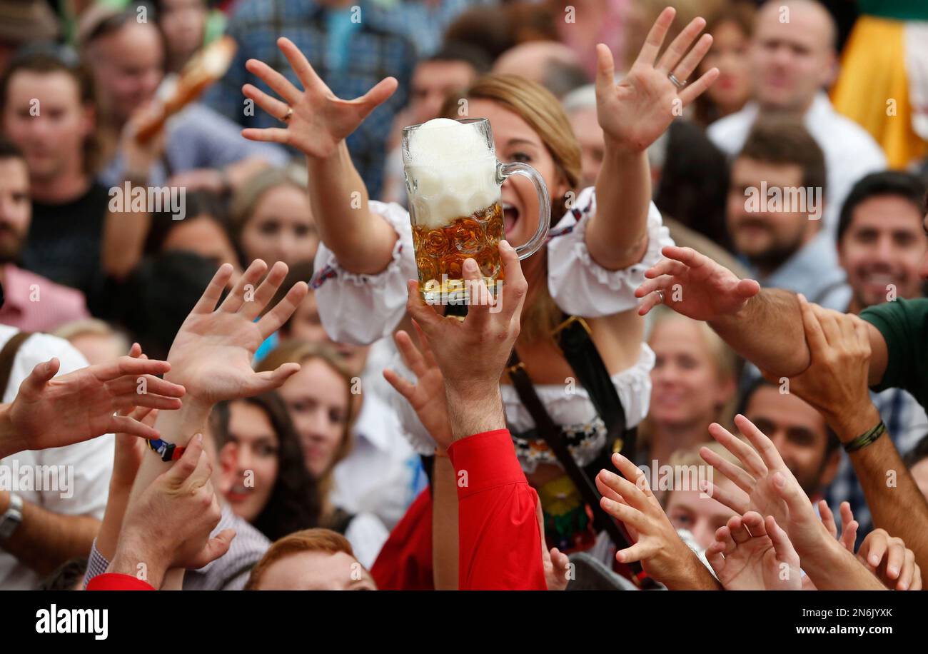 People celebrate the opening ceremony in the "Hofbraeuzelt' beer tent ...