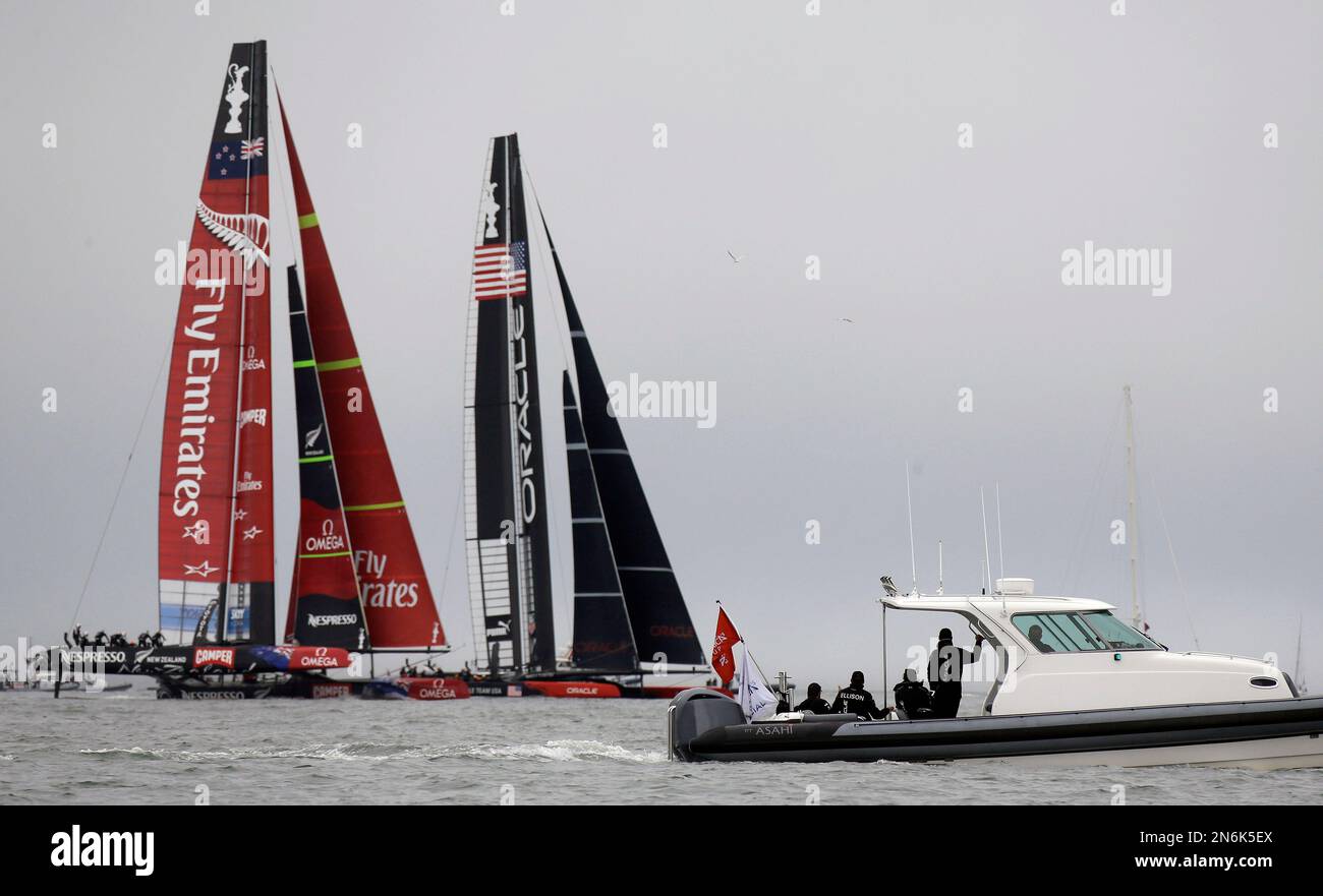 Oracle Corporation CEO Larry Ellison, second from left, watches ...