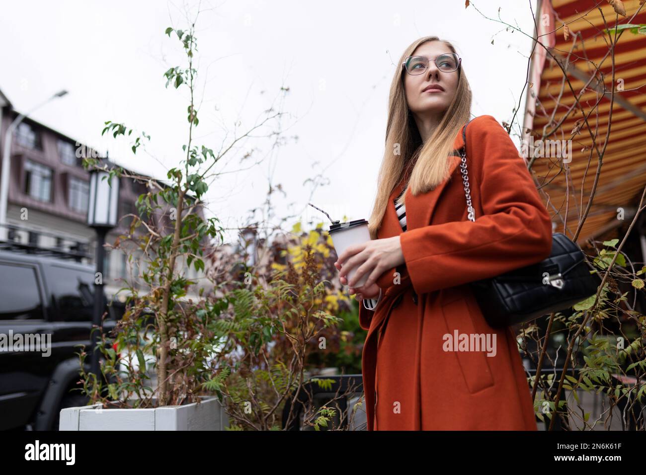 stylish young woman of model appearance outside Stock Photo - Alamy