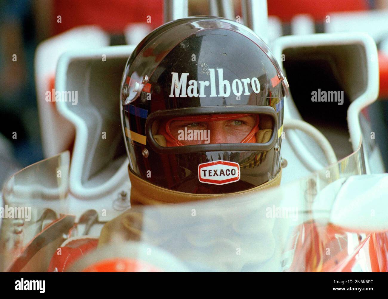 Race car driver James HUnt wearing racing helmet, 1976. Location ...